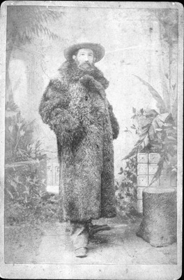 "Uninidentified man in buffalo or bearskin coat"
